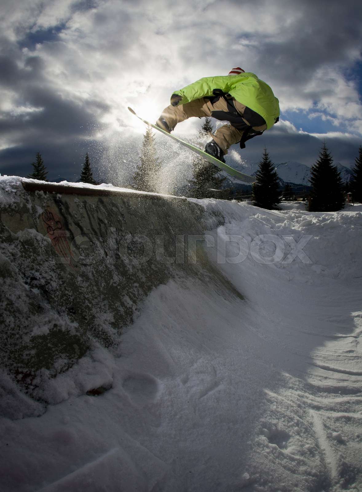Snowboarder jumping on half-pipe | Stock image | Colourbox