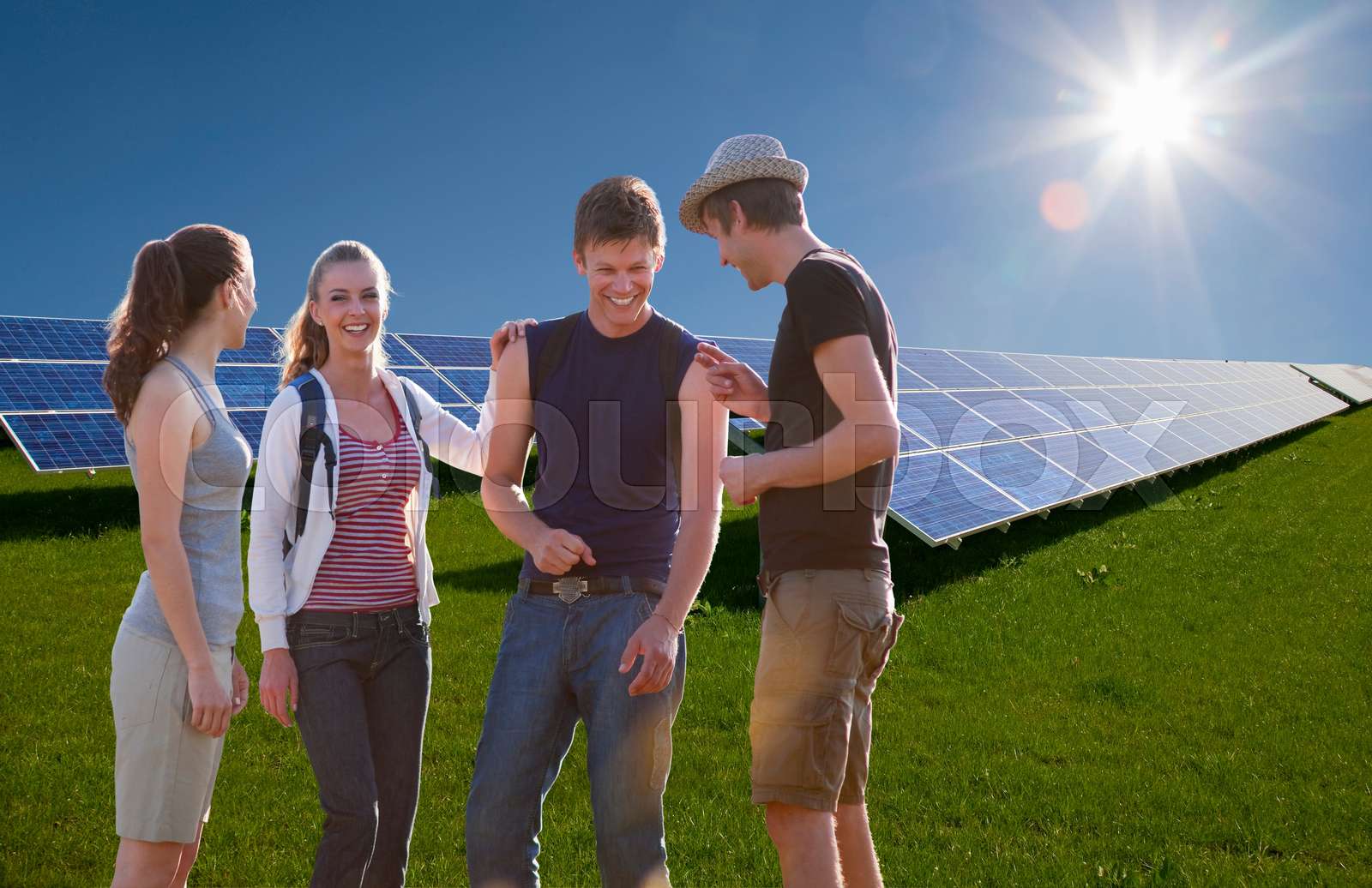 People talking by solar panels | Stock image | Colourbox