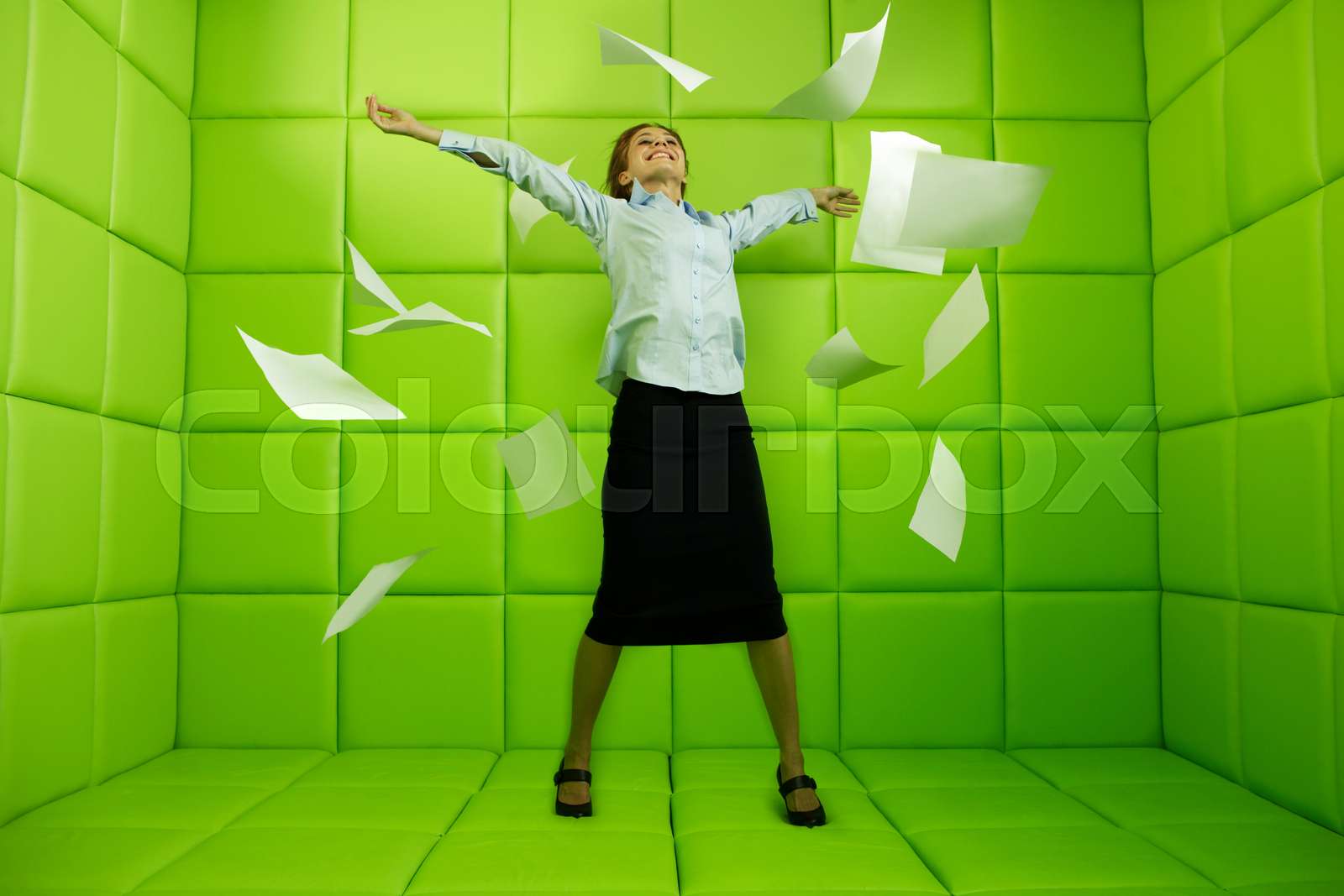 Woman throwing papers around | Stock image | Colourbox
