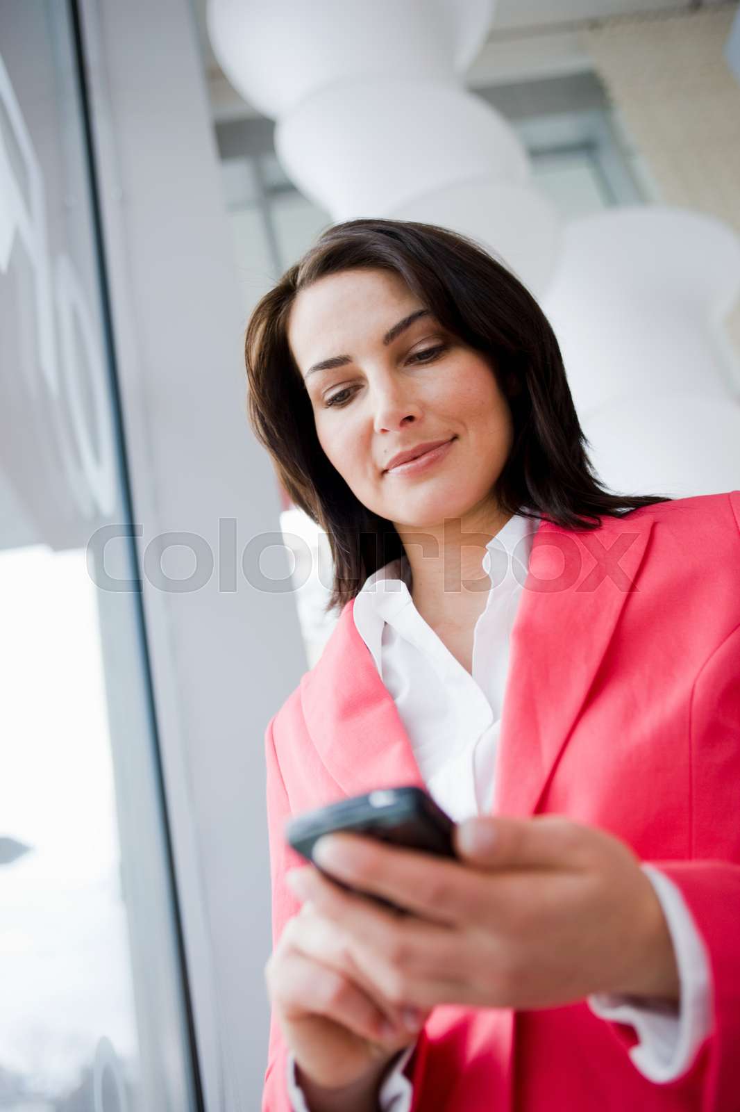 Woman text messaging | Stock image | Colourbox