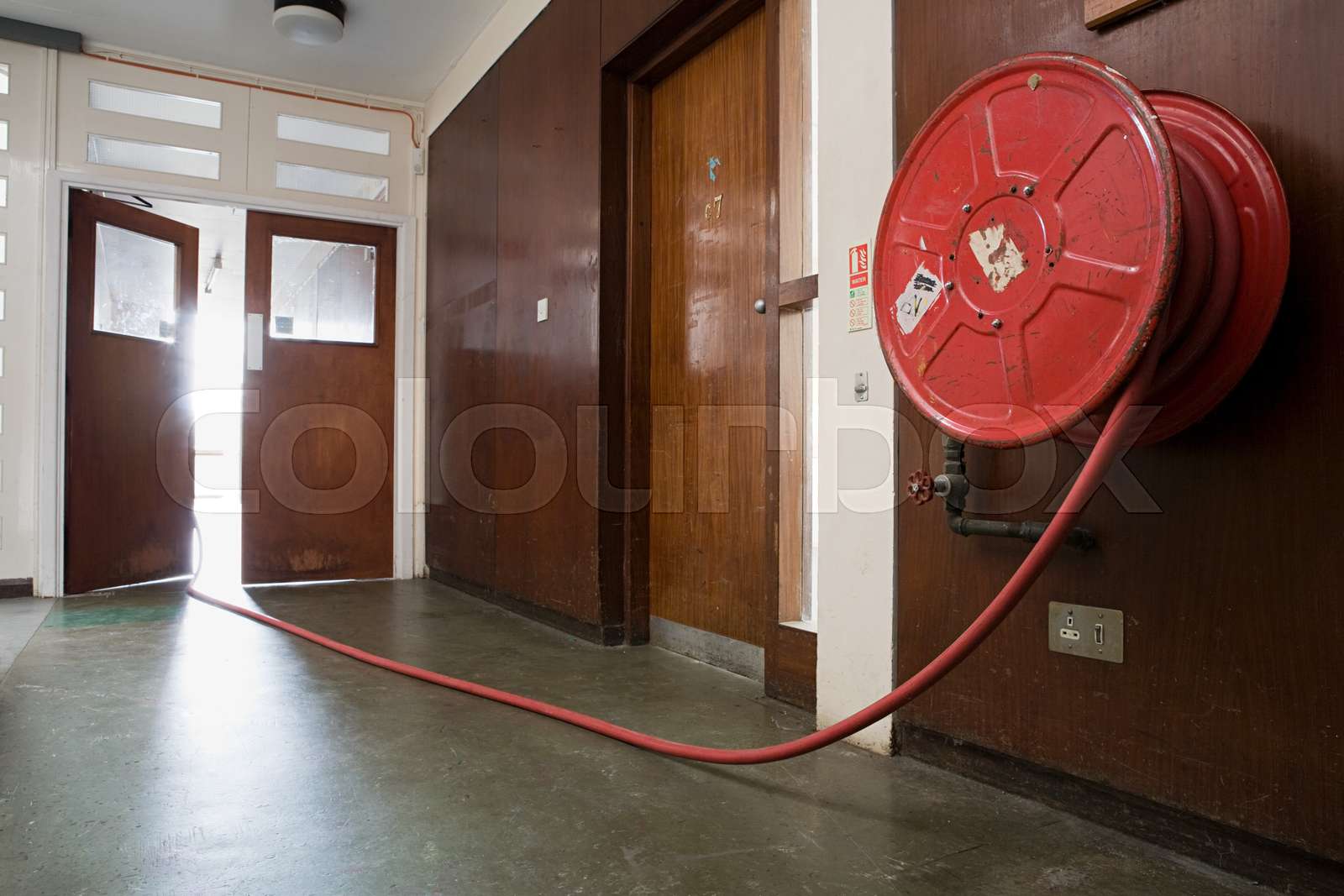 Fire hose in corridor | Stock image | Colourbox