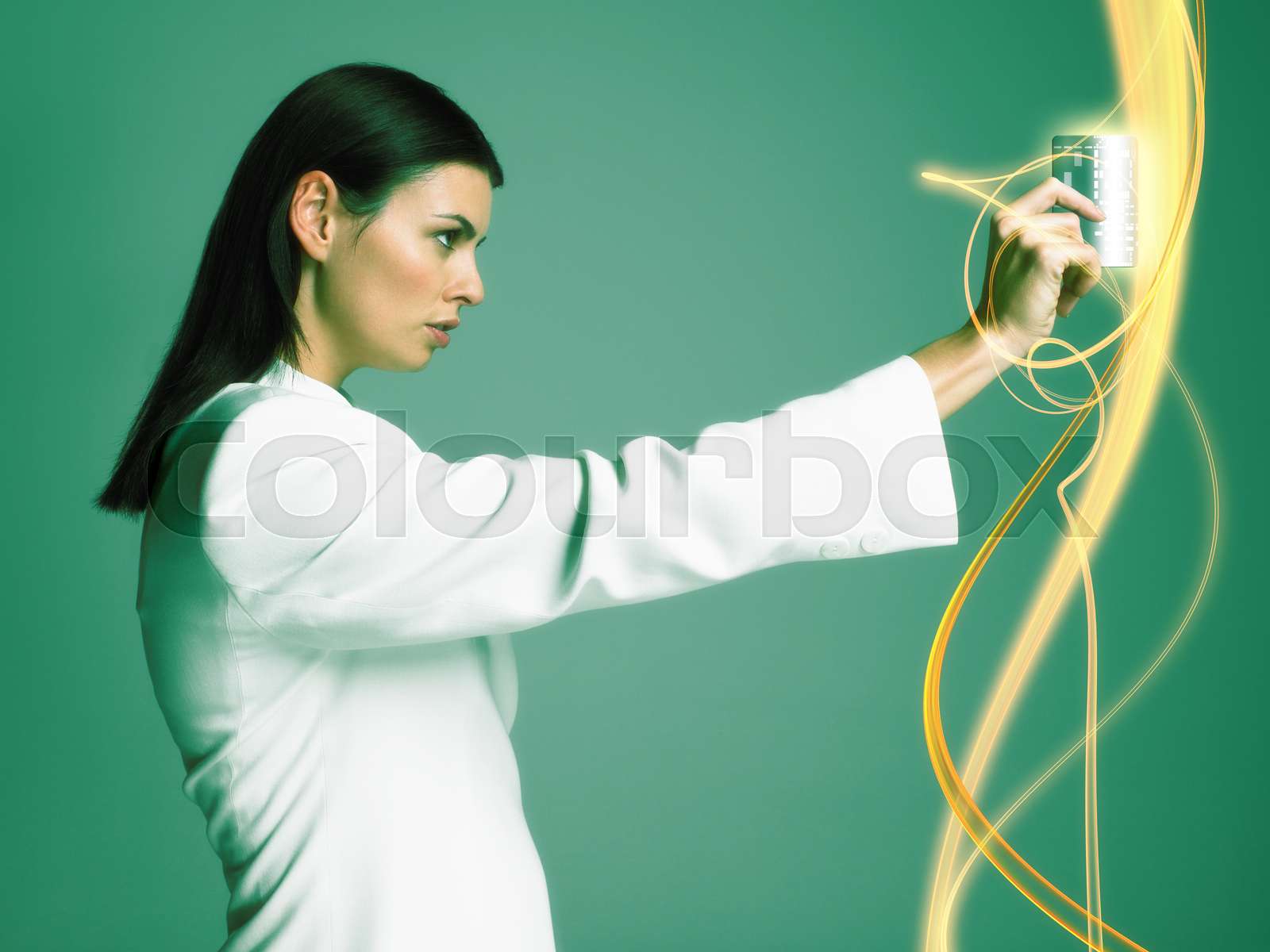 Woman using key card | Stock image | Colourbox