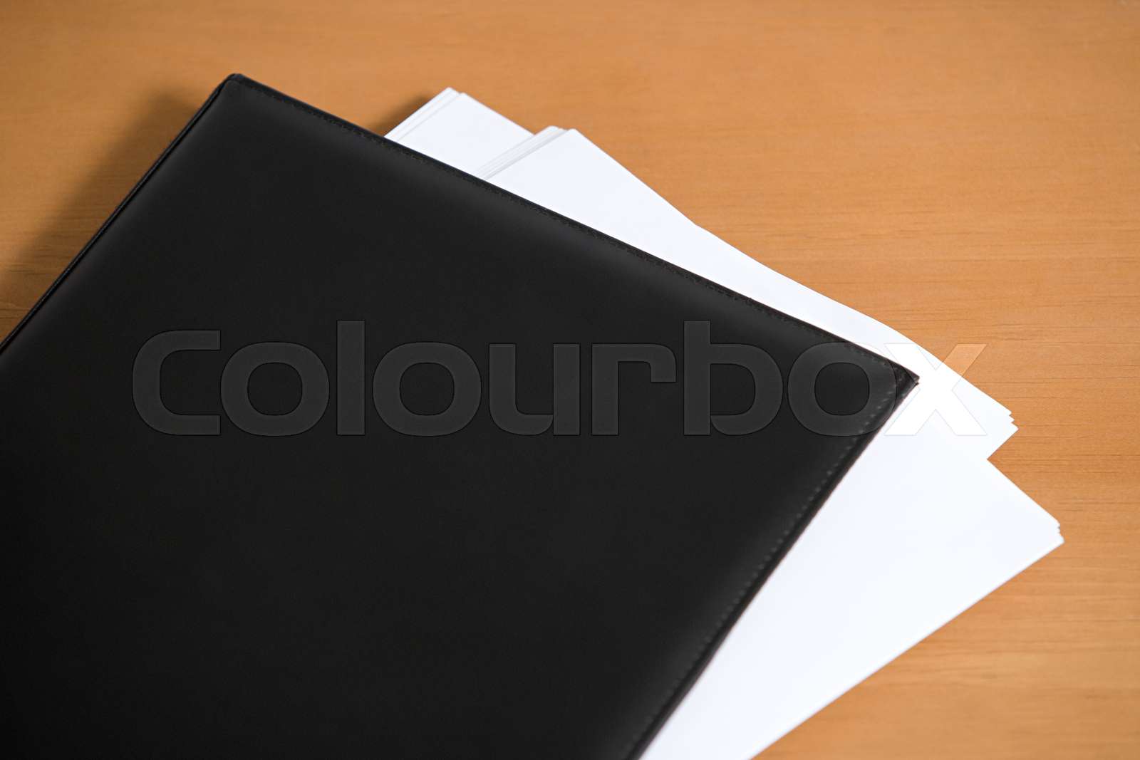 A folder on a desk | Stock image | Colourbox