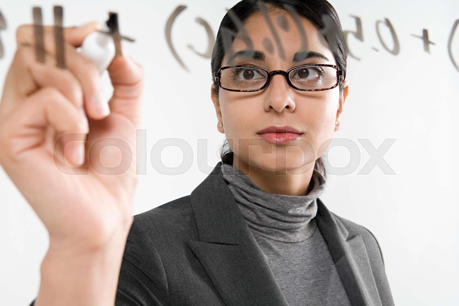 Scientist writing formula | Stock image | Colourbox
