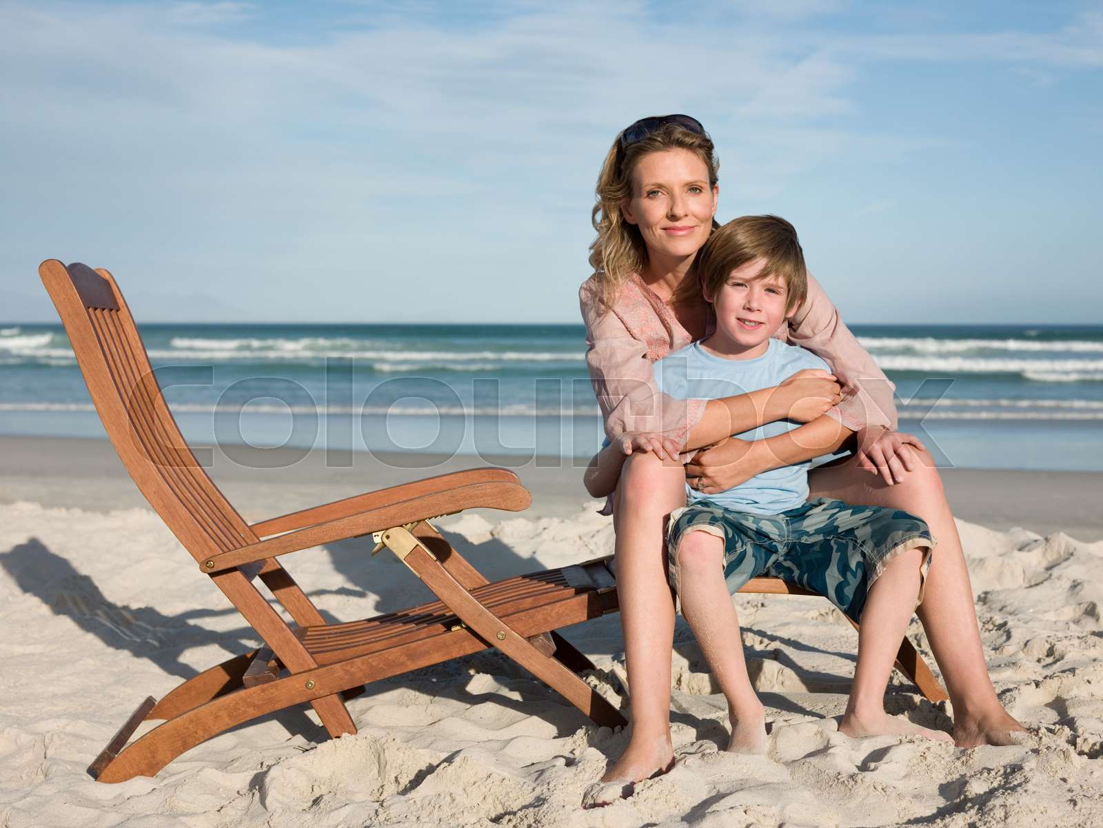 Mother And Son On Lounge Chair Stock Image Colourbox