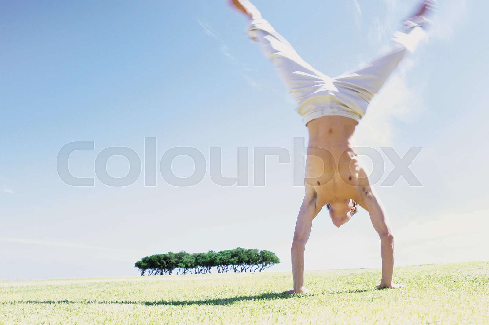 Man cartwheeling | Stock image | Colourbox