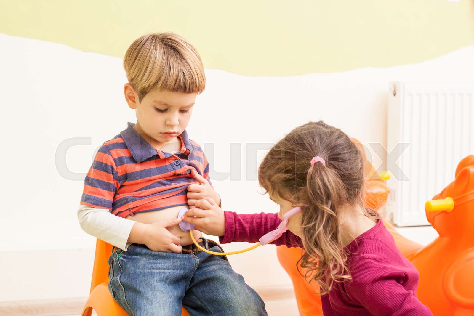 Children playing doctor and patient | Stock image | Colourbox