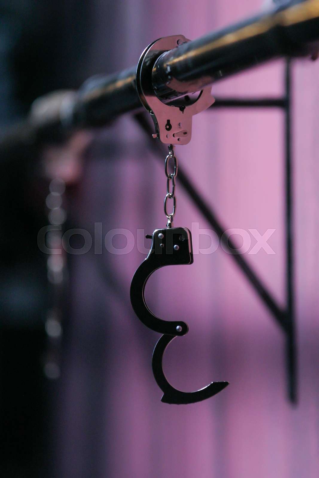 Police handcuffs hanging locked | Stock image | Colourbox