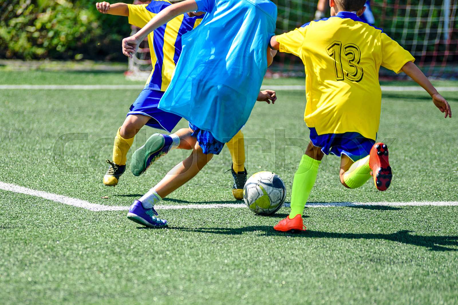 Young boys are playing football | Stock image | Colourbox