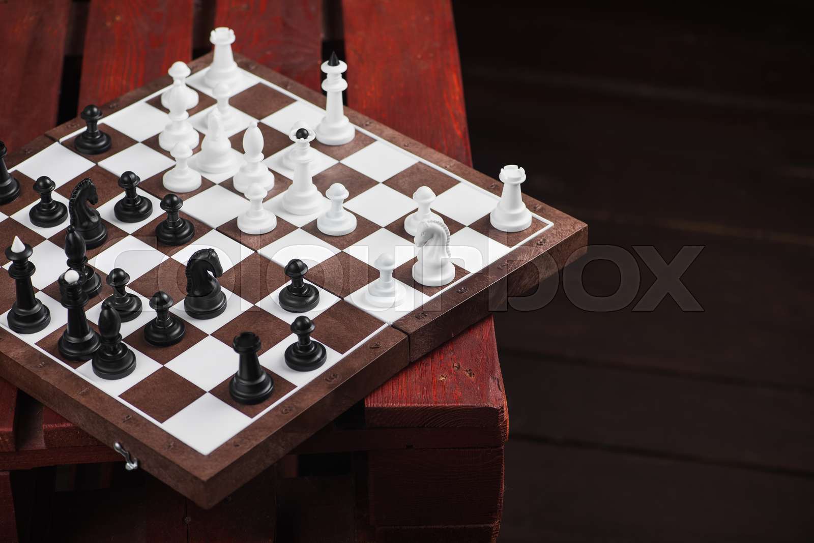 Chessboard with figures | Stock image | Colourbox