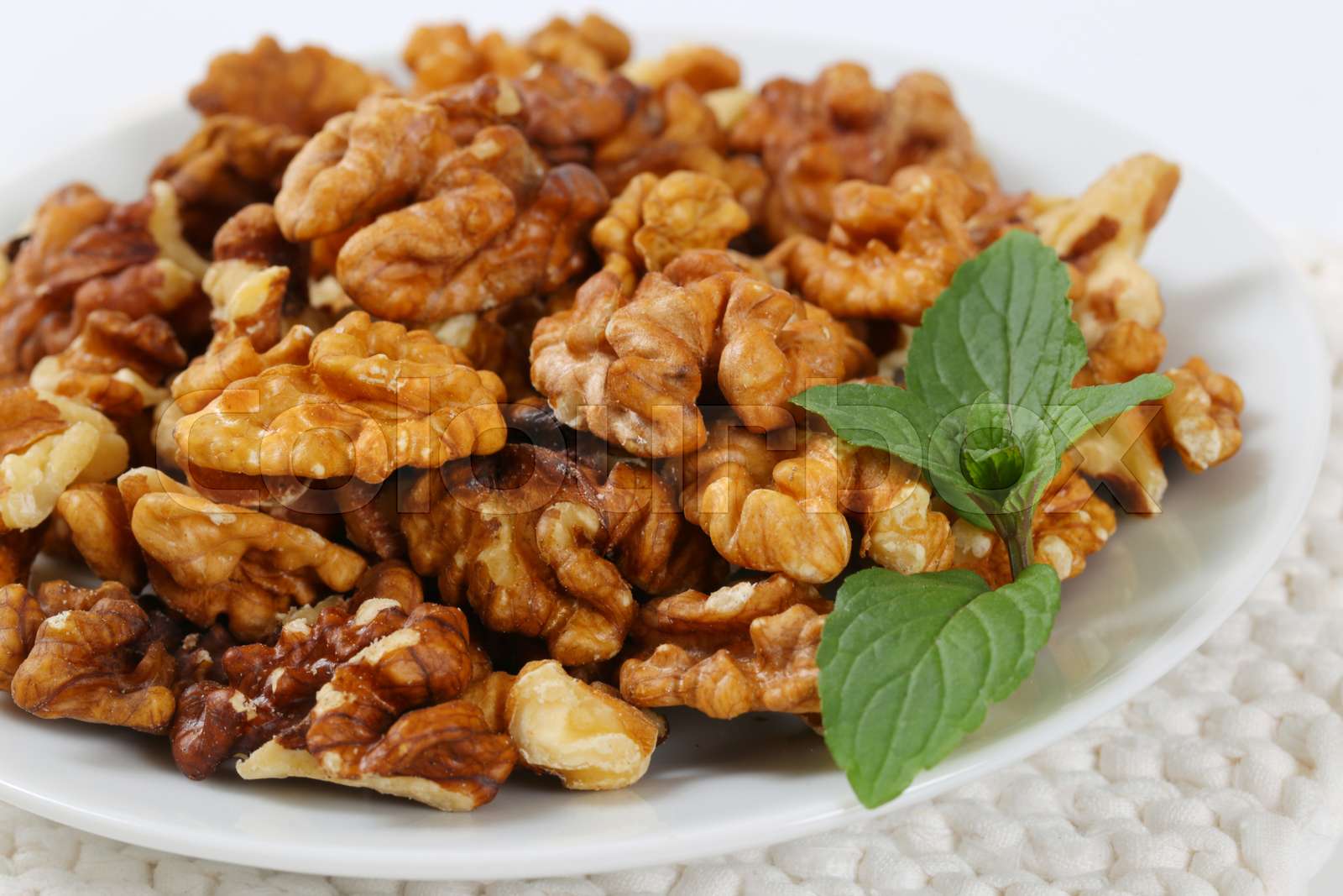 plate of peeled walnuts | Stock image | Colourbox