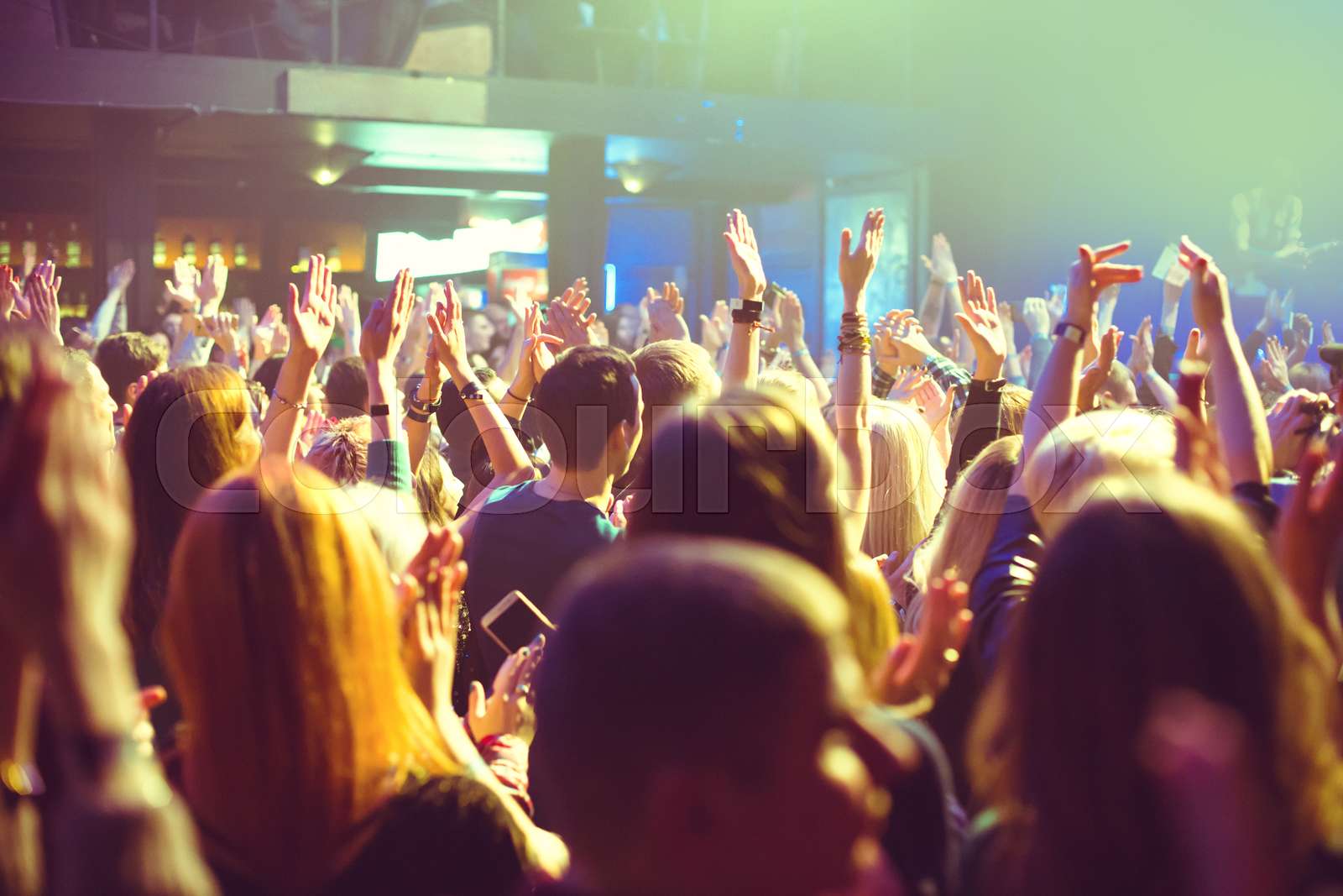 The audience watching the concert on stage. | Stock image | Colourbox