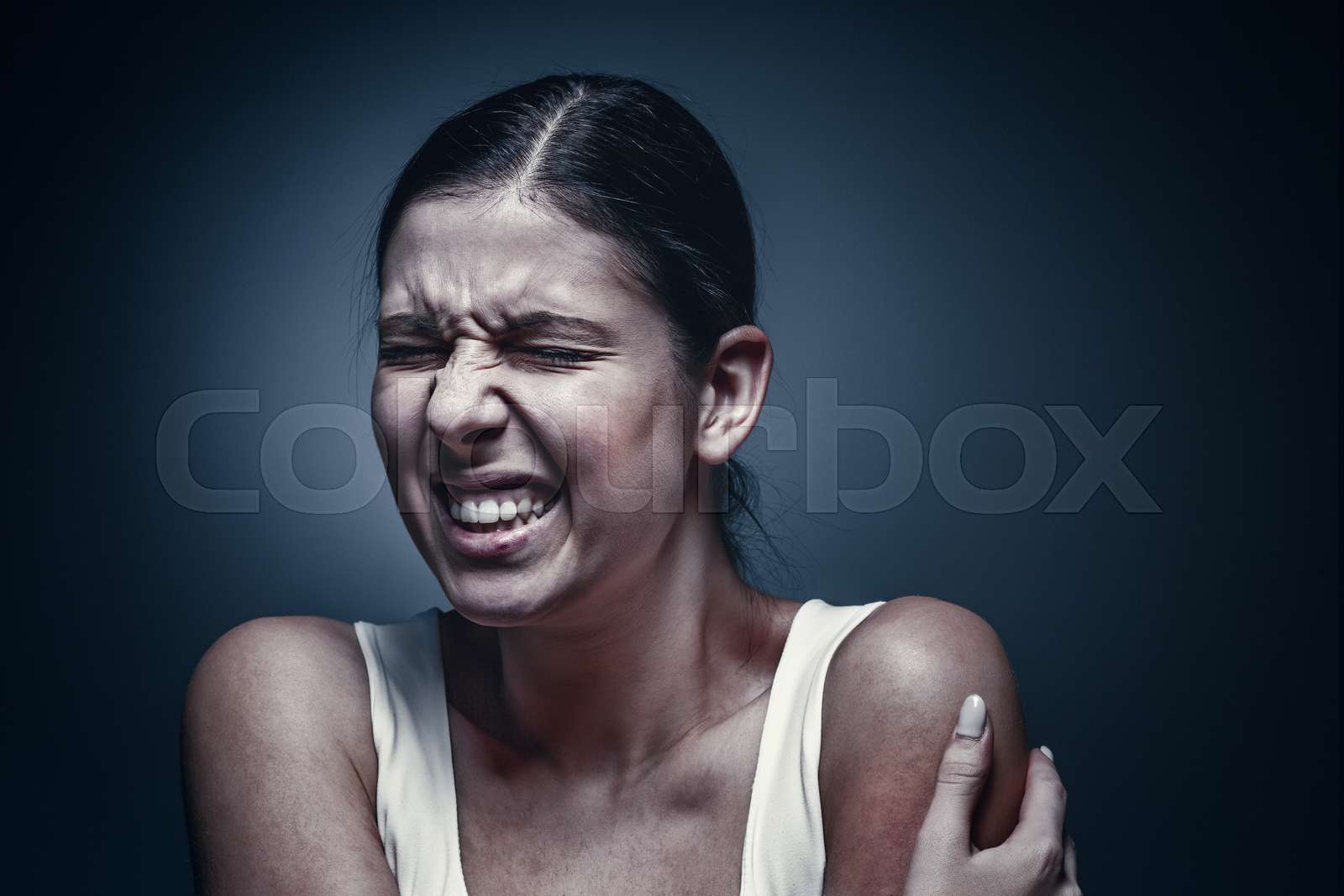 Close up portrait of a crying woman with bruised skin and black eyes ...