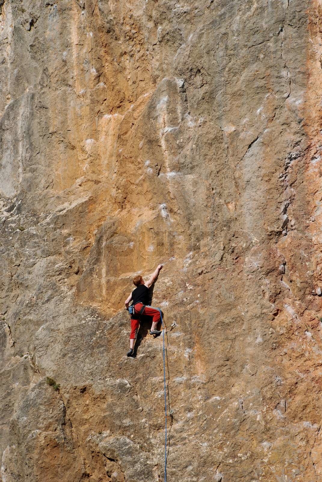 Extreme sport The rock-climber during rock conquest | Stock image ...