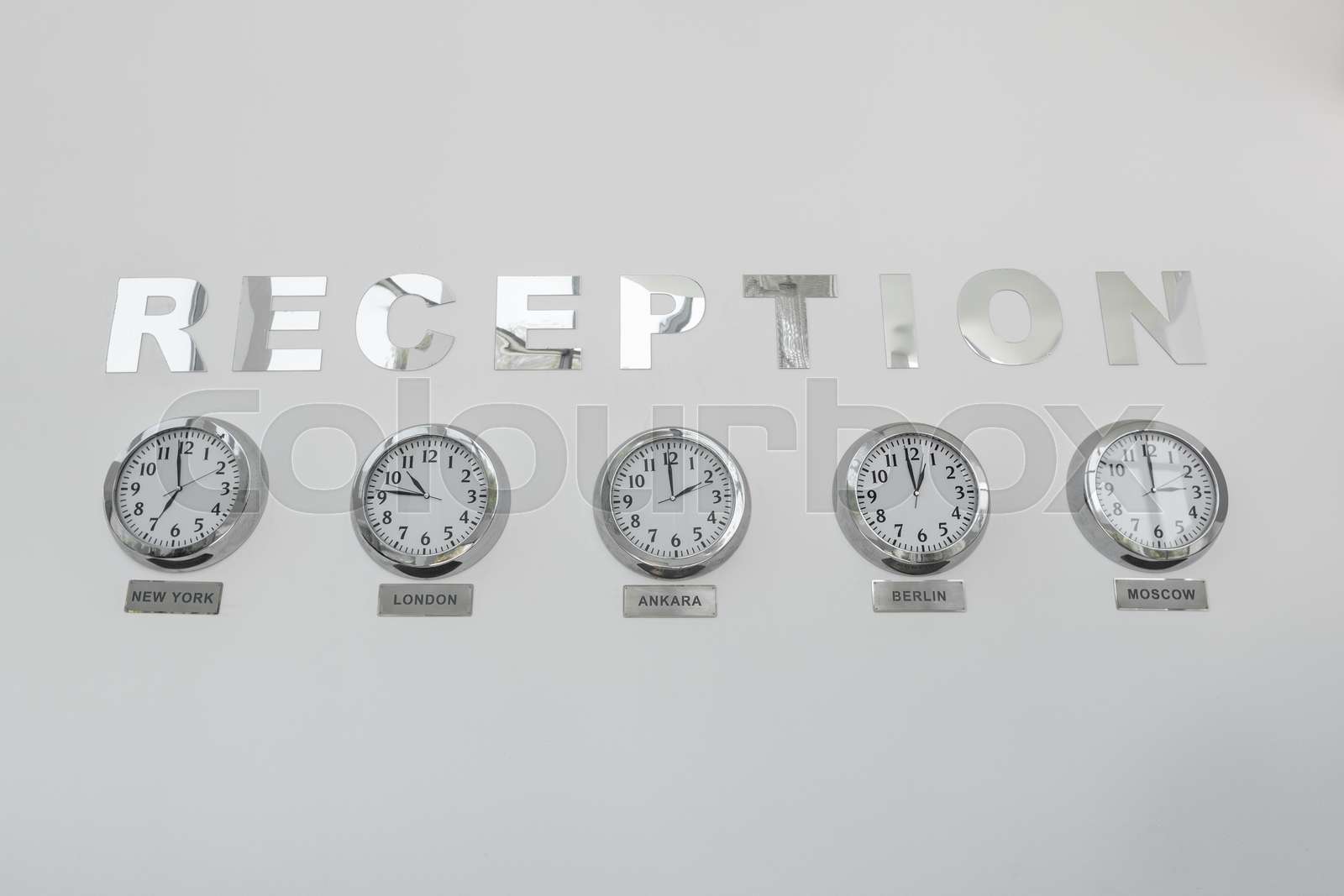 Reception desk with a clock | Stock image | Colourbox