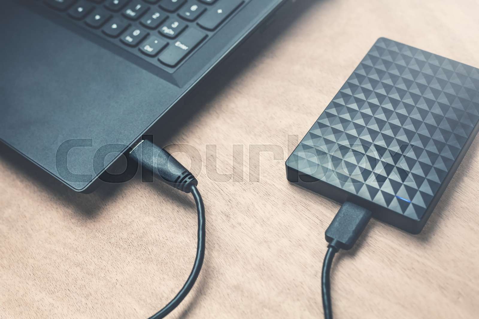 External hard drive connection on a laptop. | Stock image | Colourbox