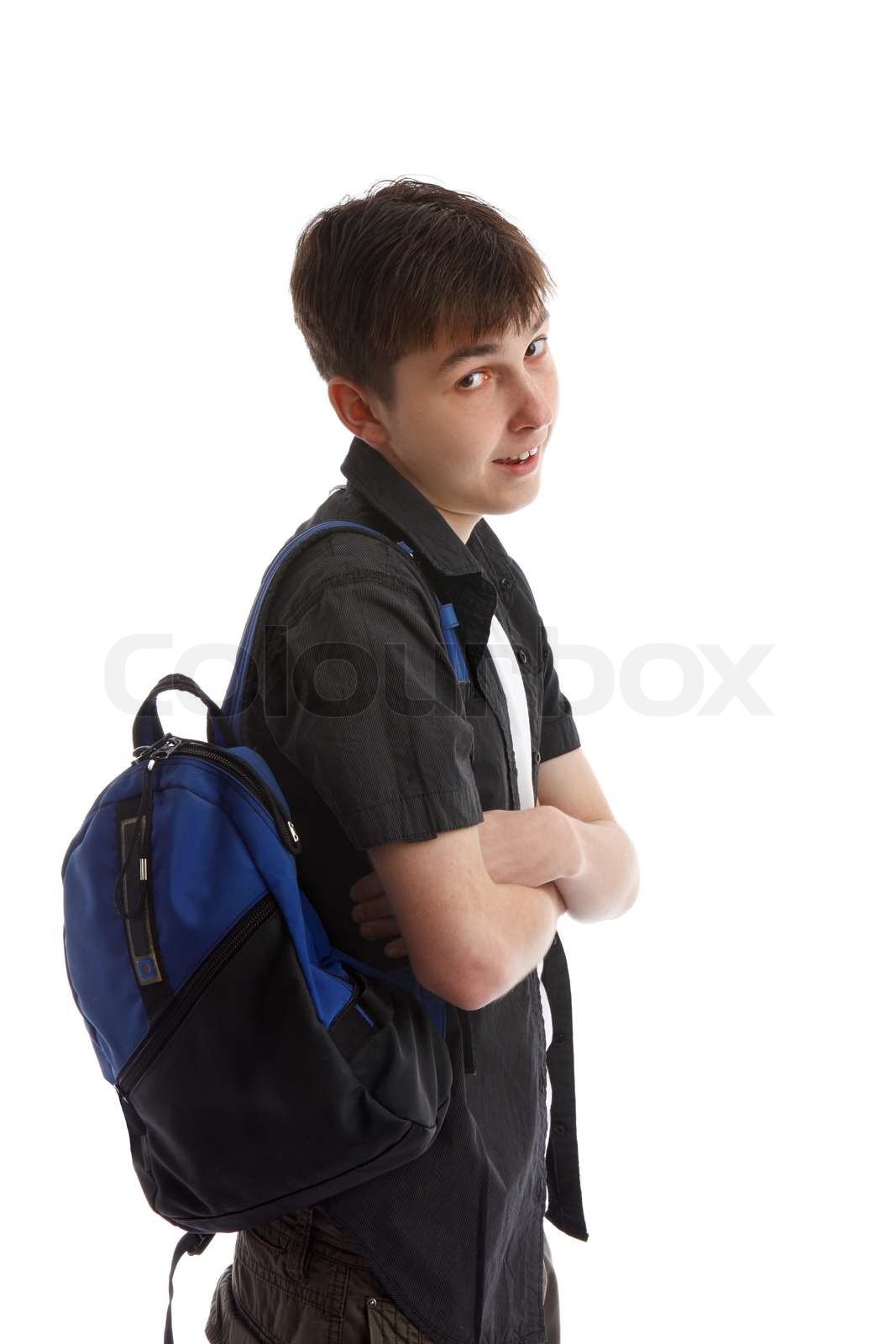 Teen student with backpack slung over shoulder He has his arms casually ...