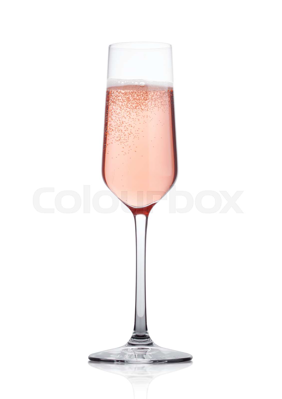 Rose pink champagne glass with bubbles isolated | Stock image | Colourbox