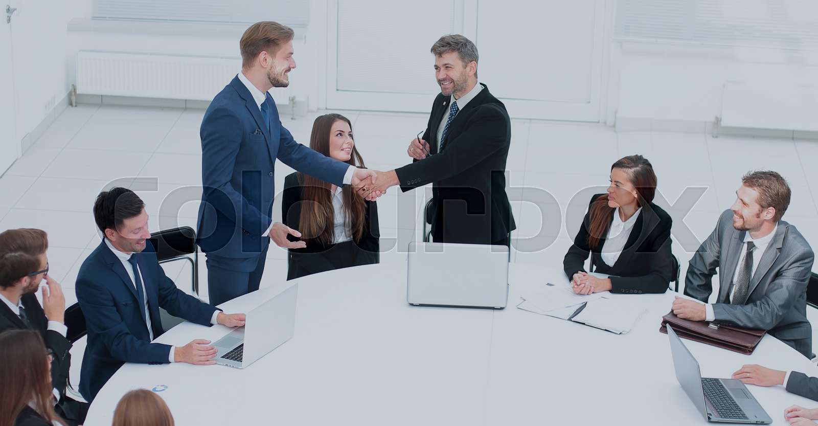 Round table discussion at Business convention and handshake. Aud ...