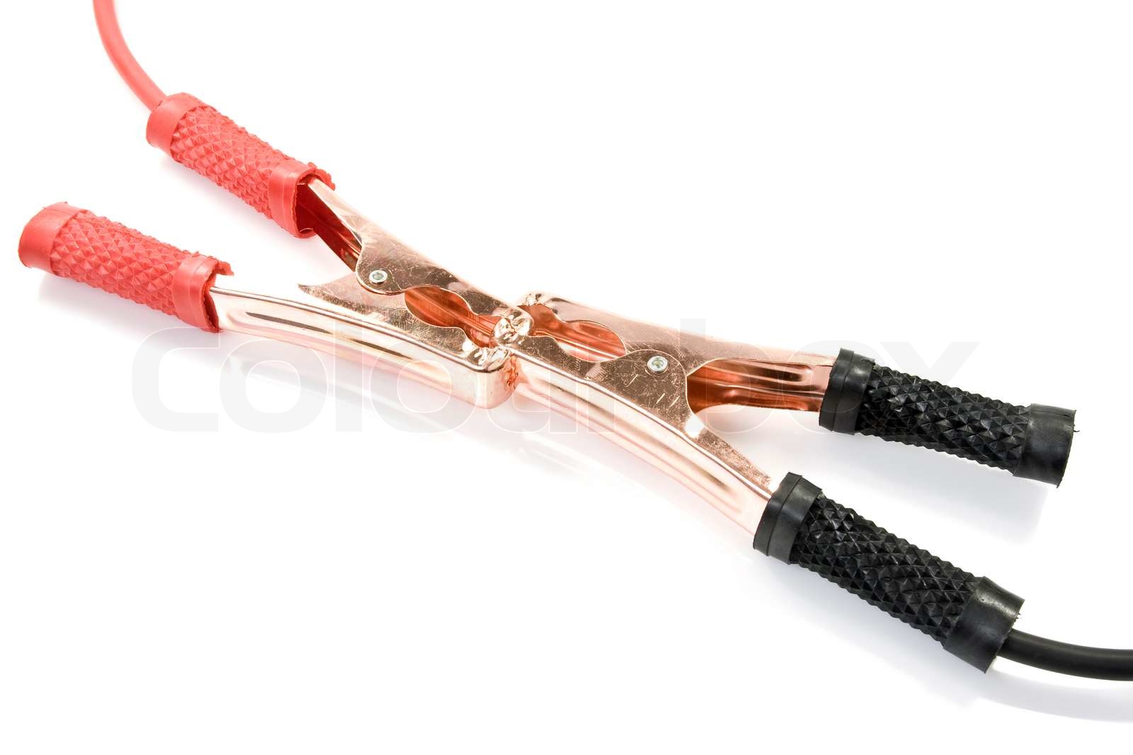 Two jumper cables engaged with their black and red clamp shot over ...