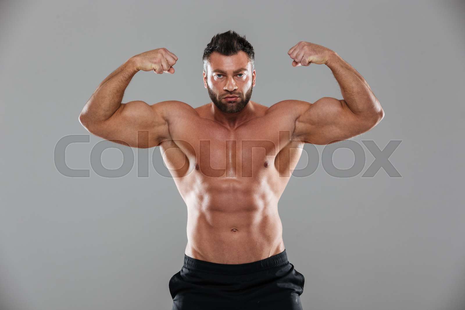Portrait of a muscular strong shirtless male bodybuilder | Stock image ...