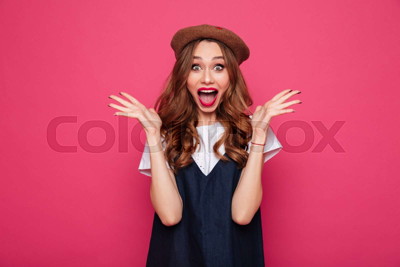 Excited beautiful lady looking camera with opened mouth isolated ...