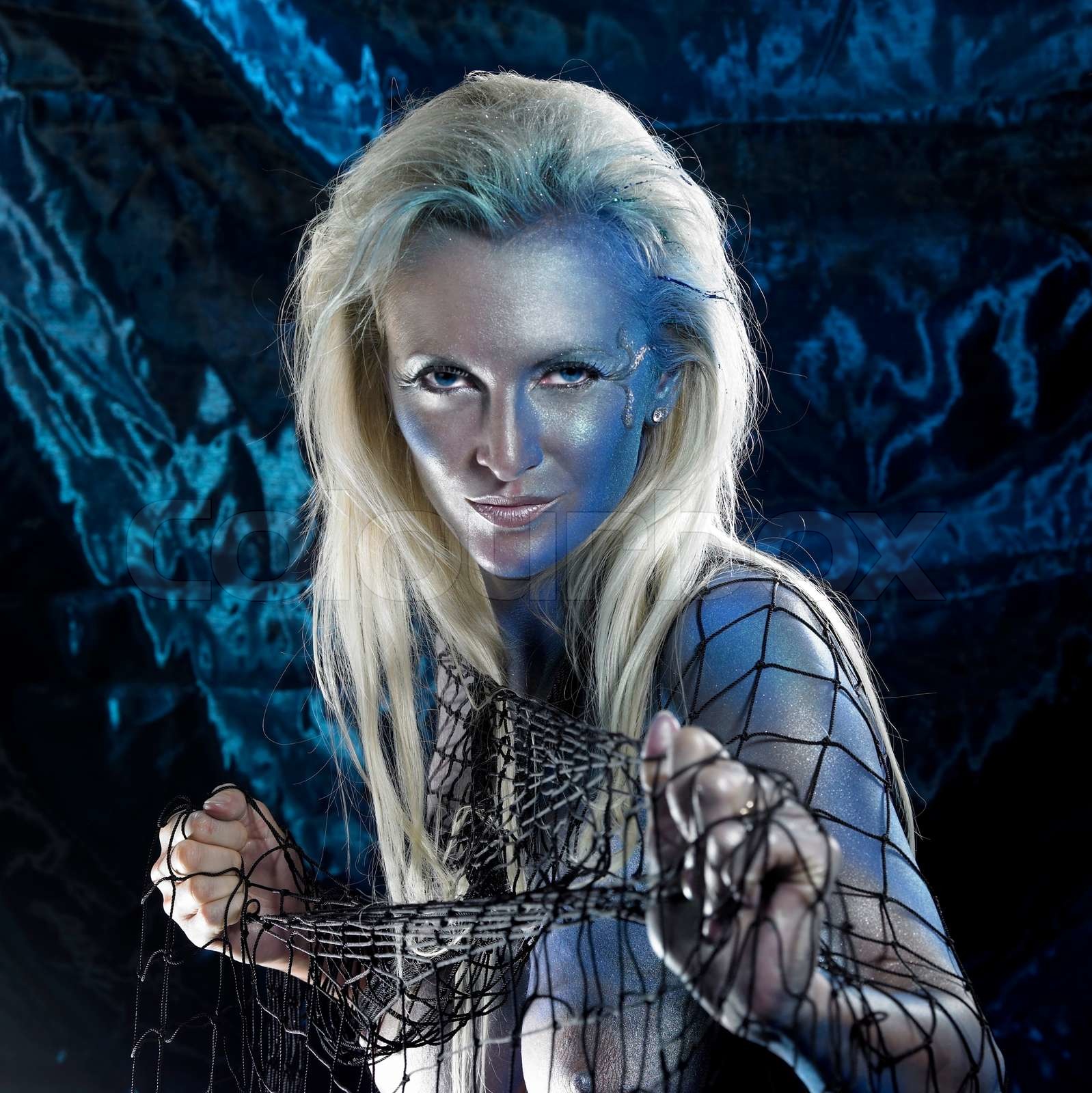 blue bodypainted woman and fabrics | Stock image | Colourbox