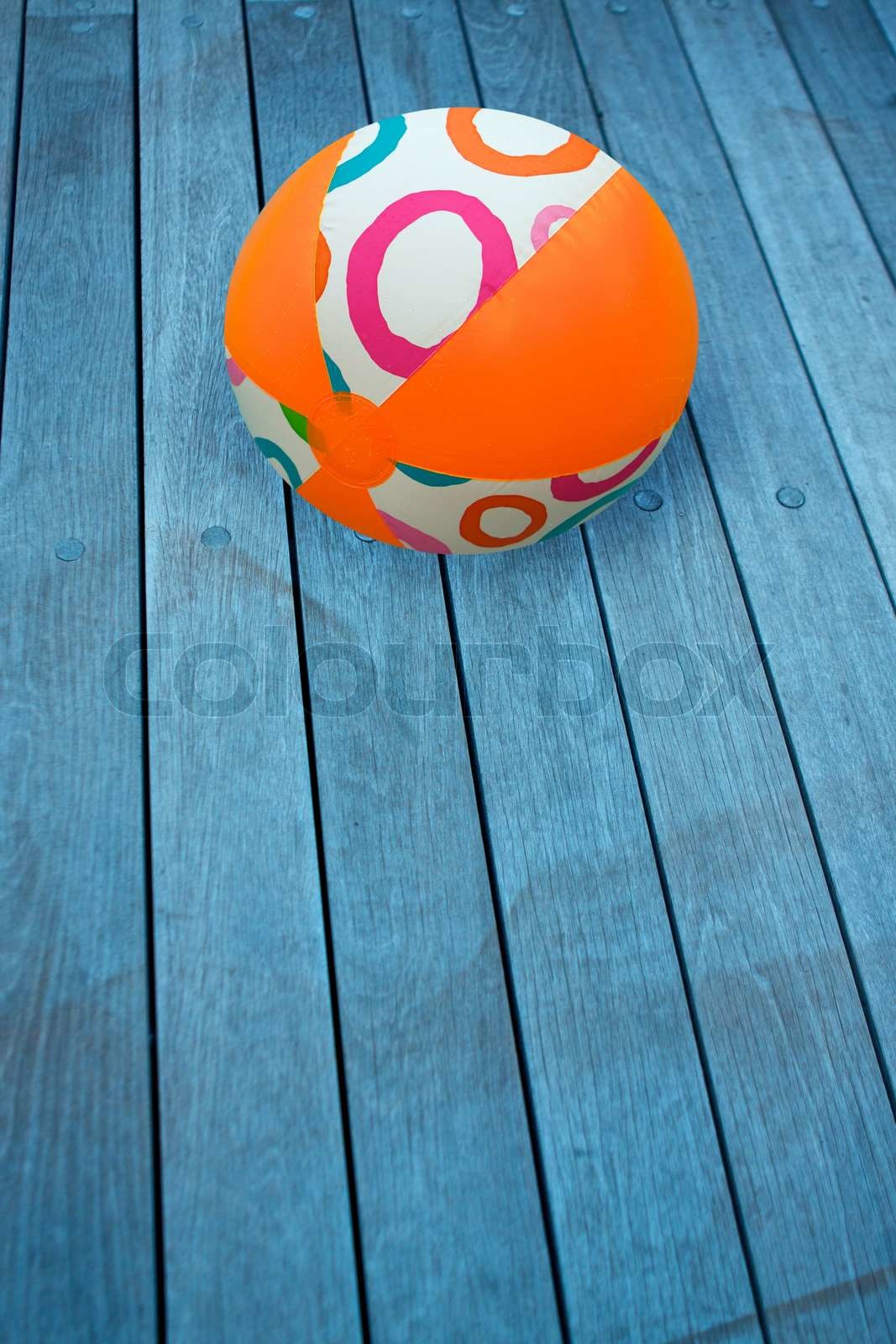 wooden-decking-with-a-beach-ball-stock-image-colourbox