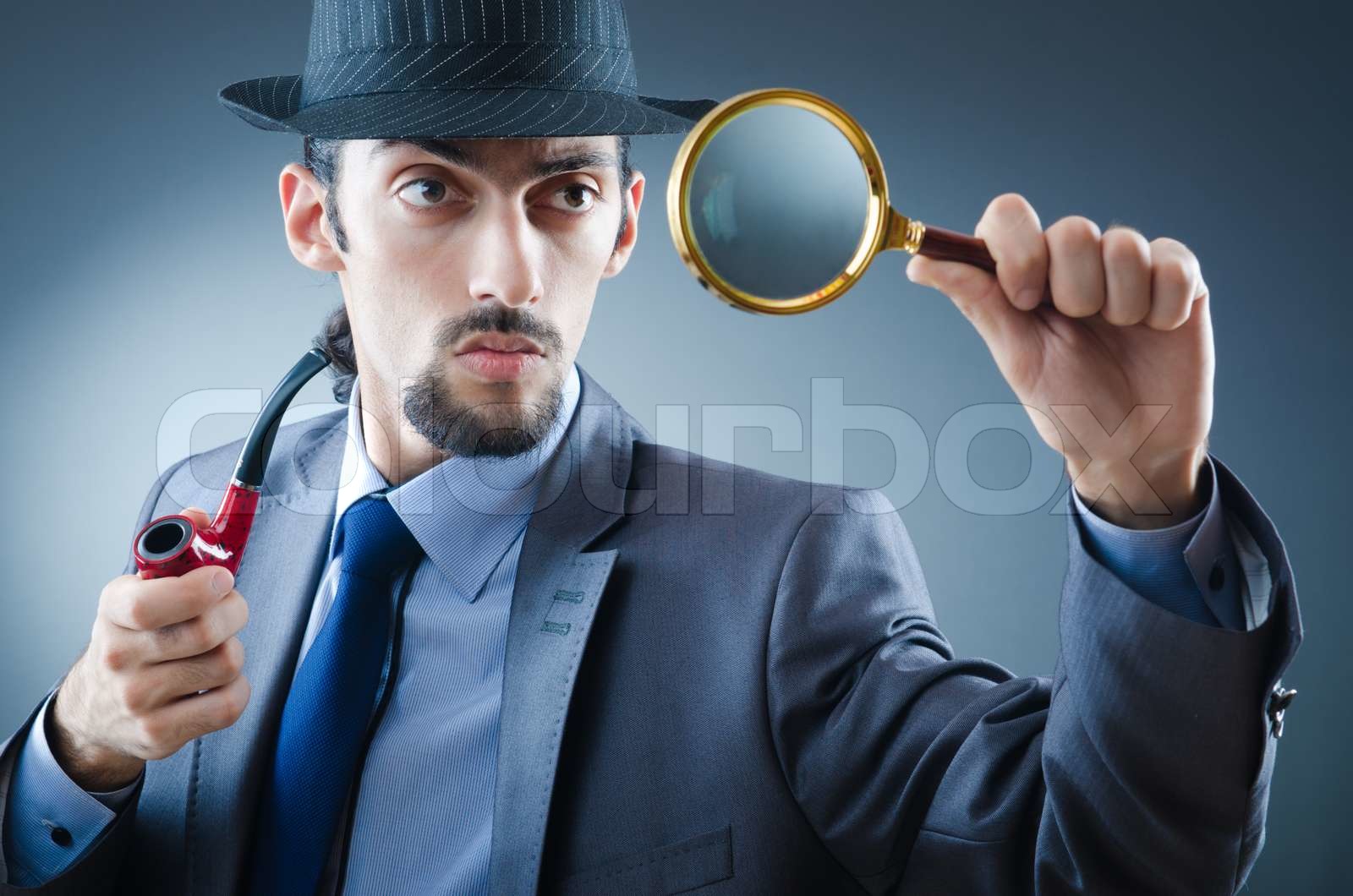 Detective with the smoking pipe | Stock image | Colourbox