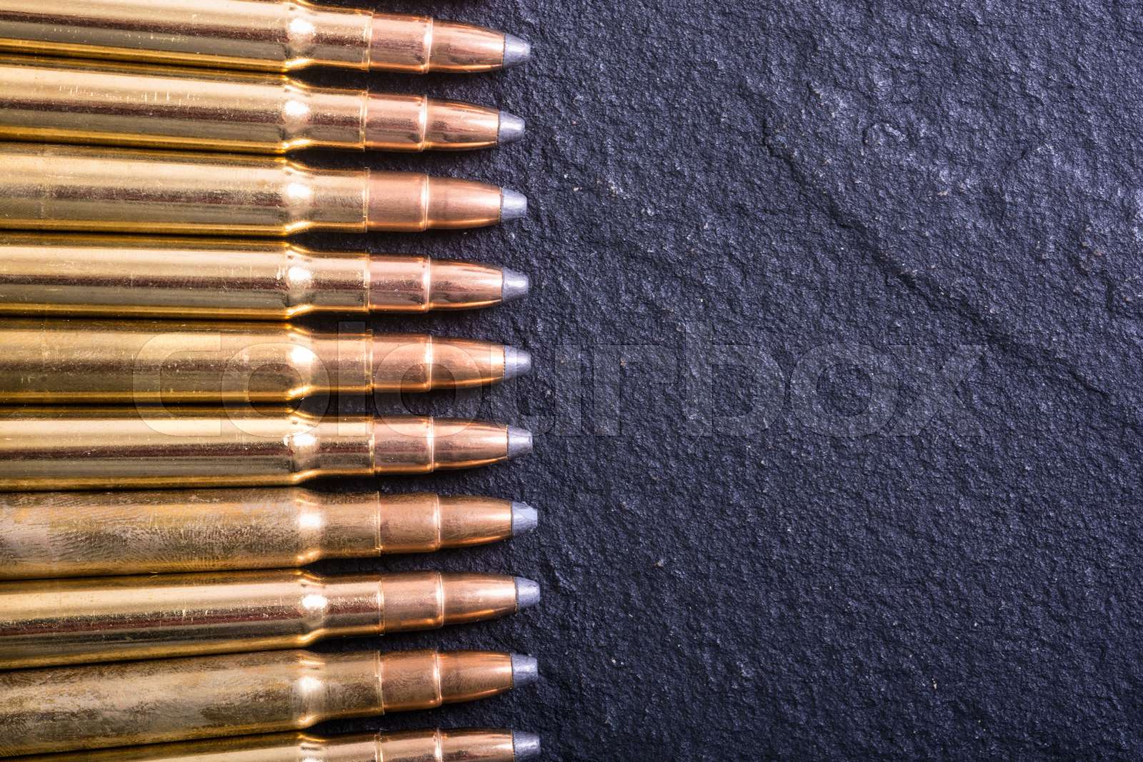Gun cartridge 8mm caliber | Stock image | Colourbox