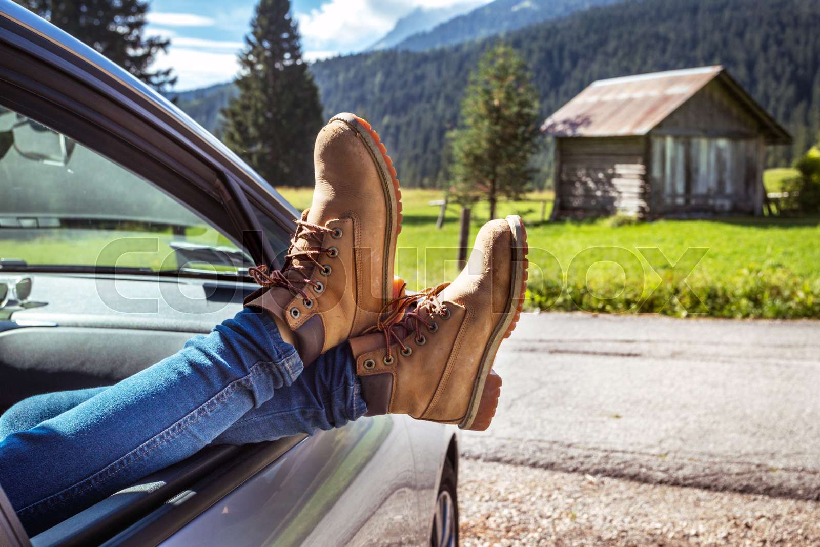 Girl legs sticking out of the car | Stock image | Colourbox