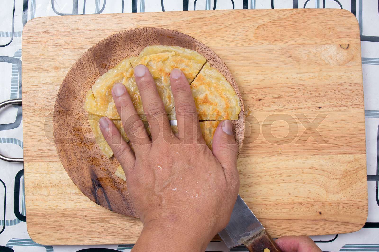 Chef prepared cooked Roti to the plate | Stock image | Colourbox