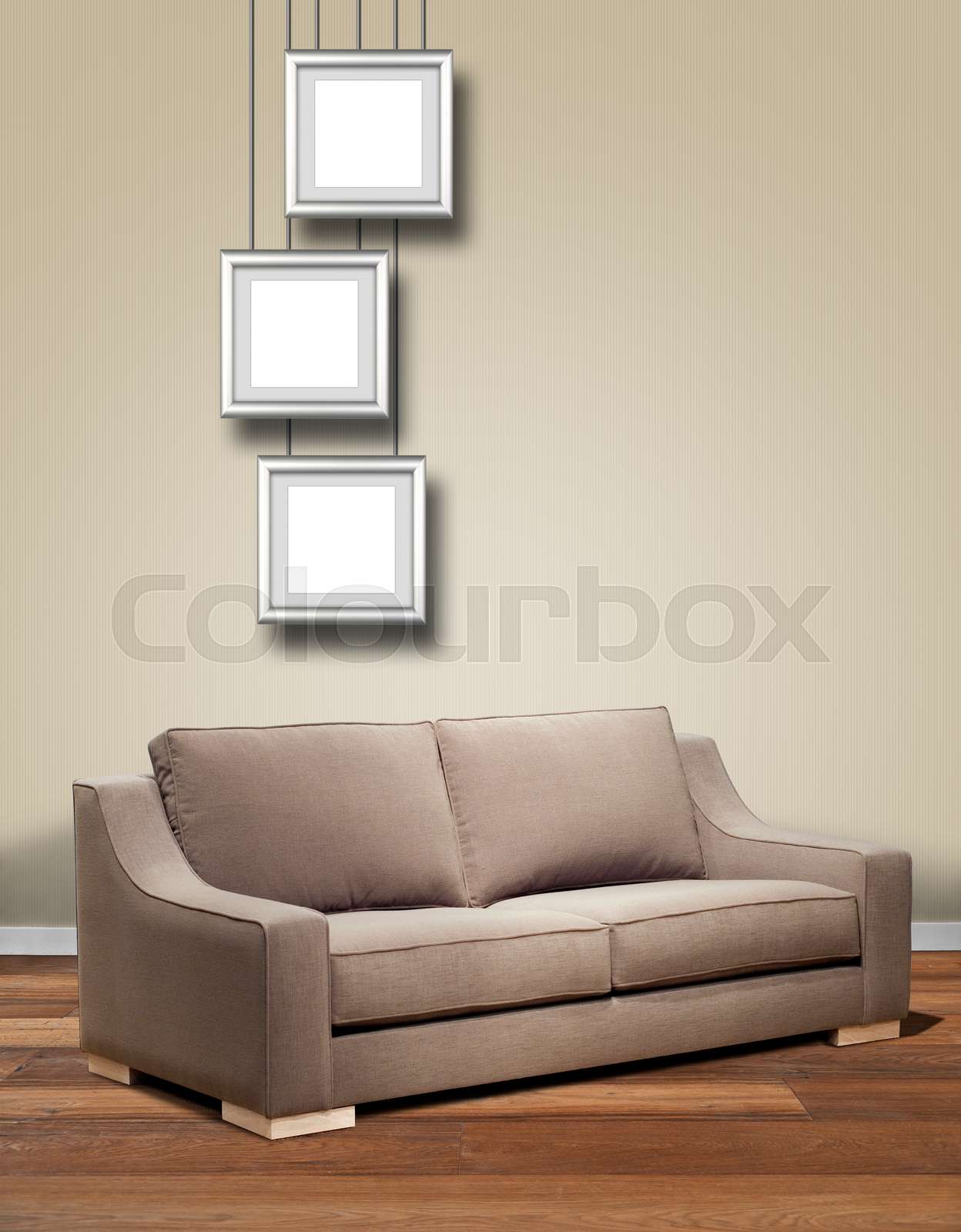 Modern interior with sofa and three hanging alu frame. | Stock image ...