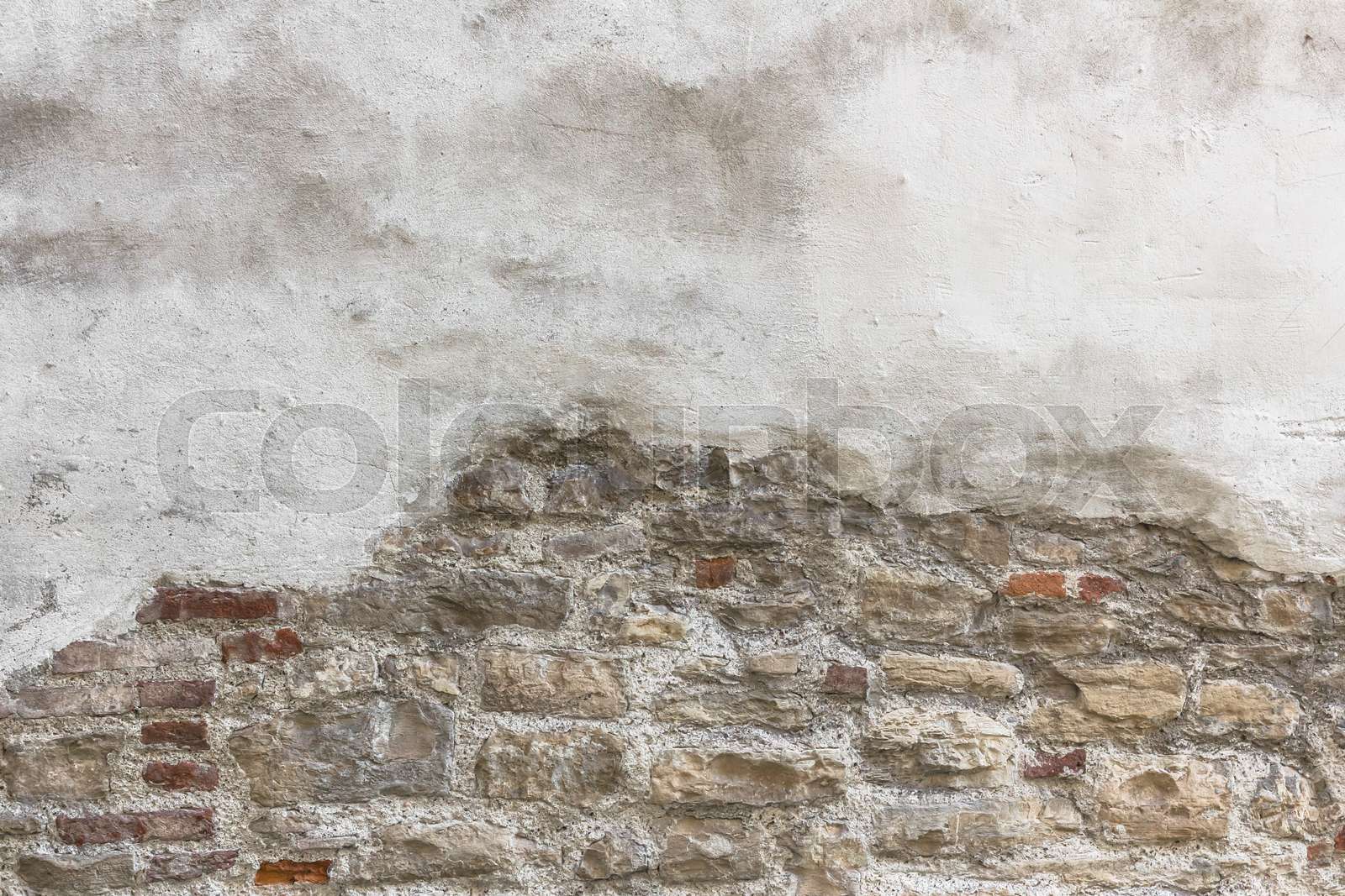 Partially newly plastered brick wall | Stock image | Colourbox