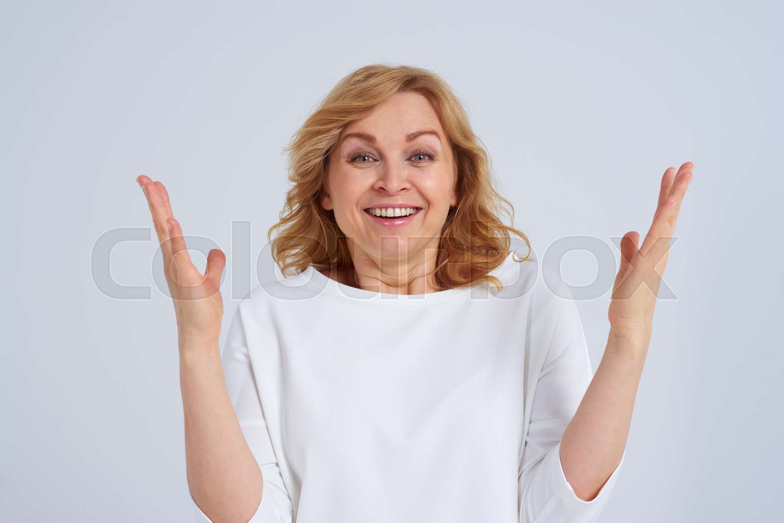 Surprised smiley blond | Stock image | Colourbox
