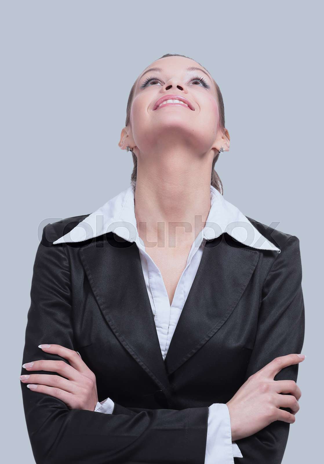 Beautiful young business woman looking up isolated | Stock image ...