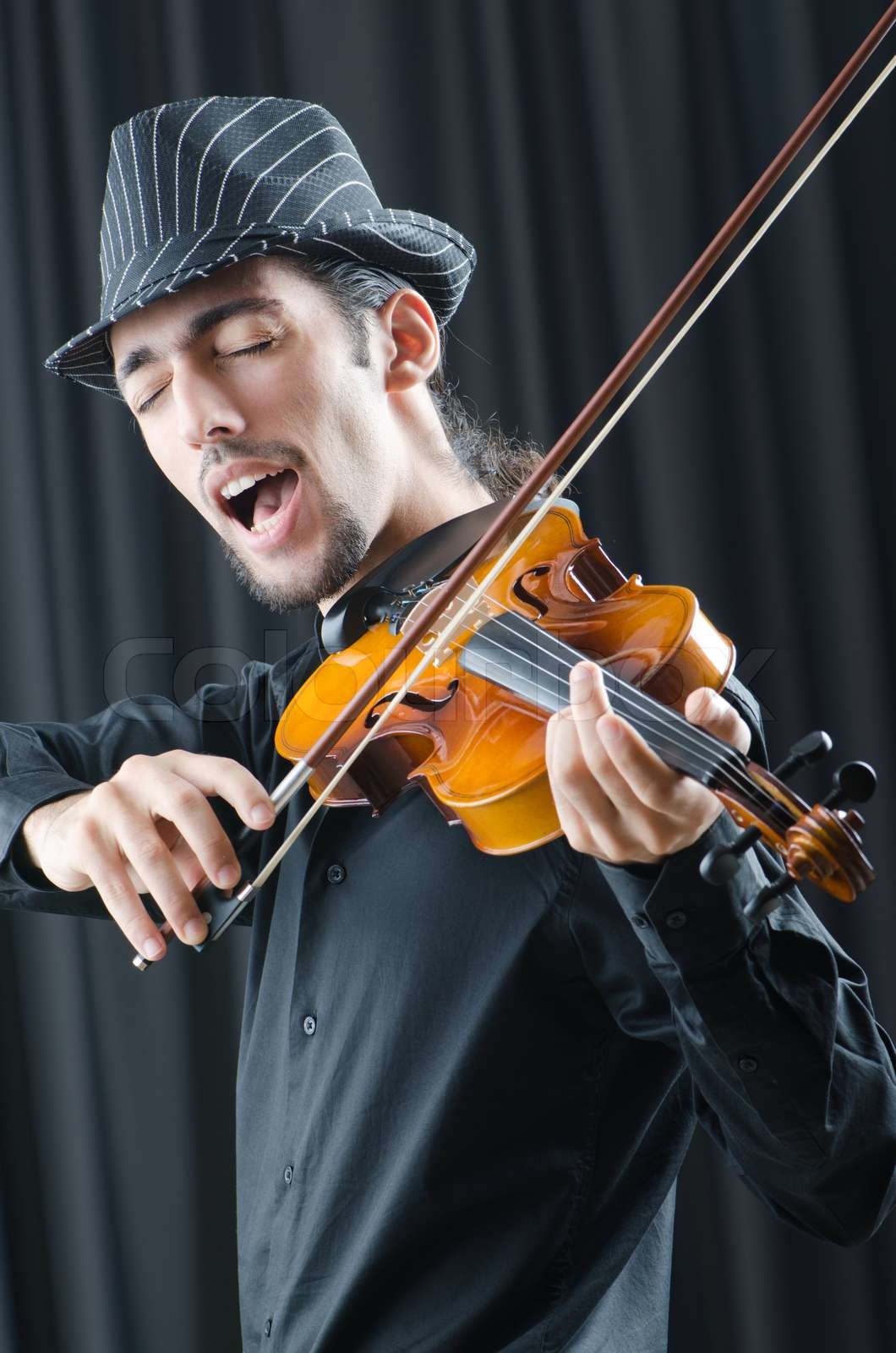 Fiddler playing the violin | Stock image | Colourbox