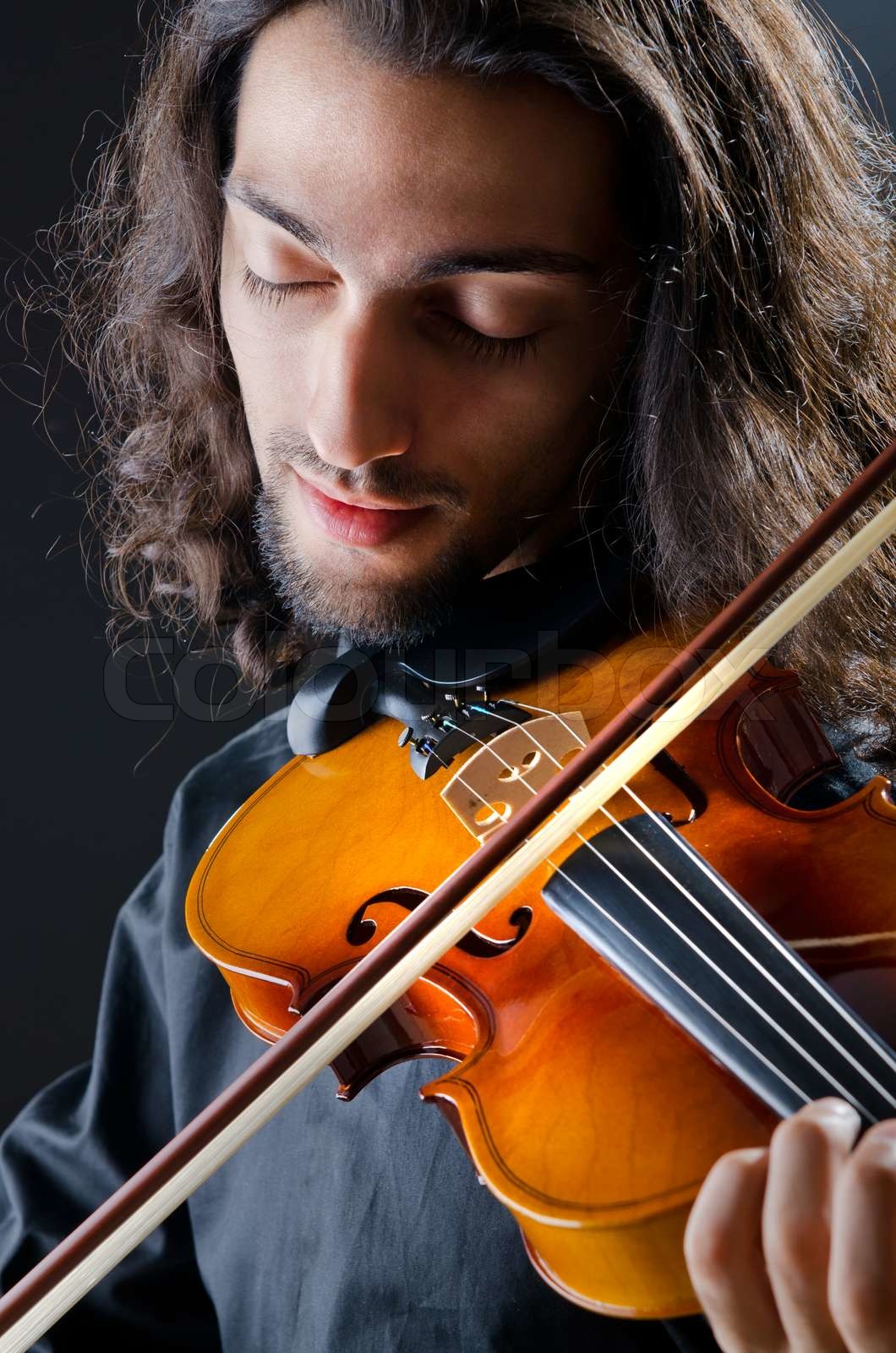 Violin player playing the intstrument | Stock image | Colourbox