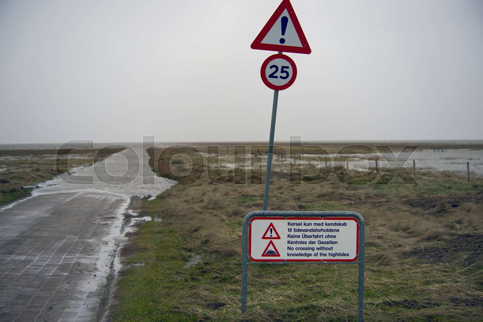 Warning signs close to causeway | Stock image | Colourbox