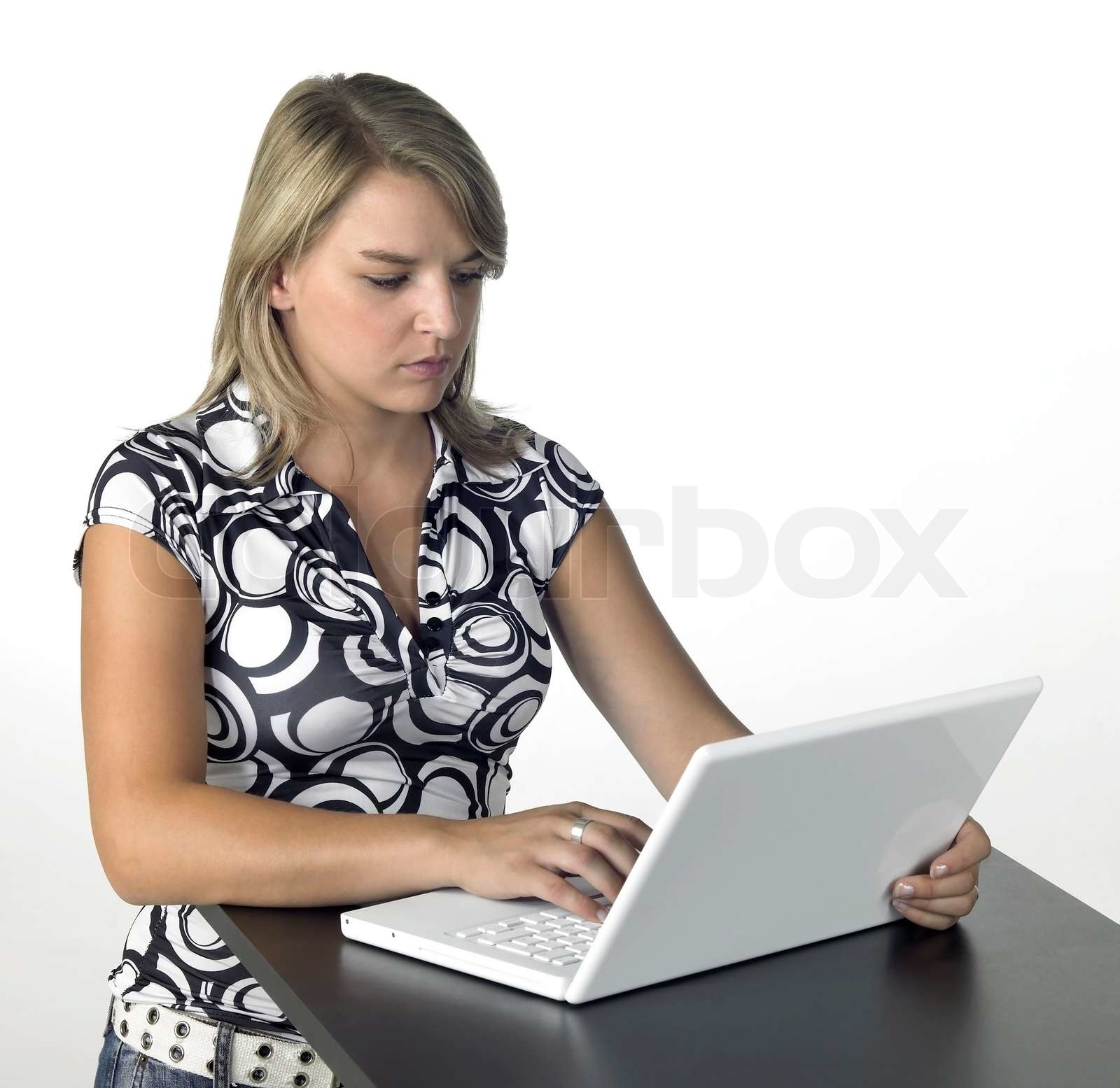 cute girl working with laptop in light back | Stock image | Colourbox