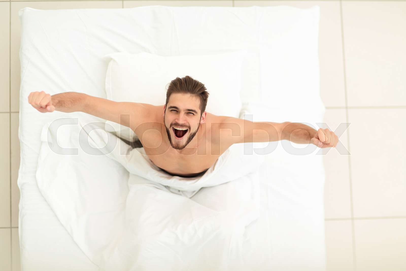 top view.a very happy man | Stock image | Colourbox