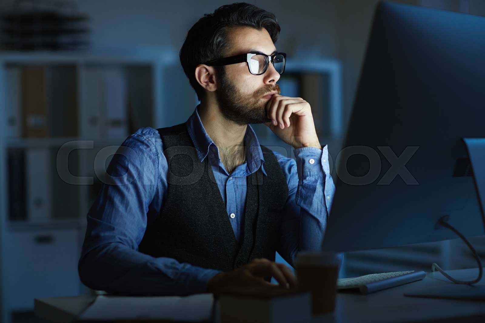 Man working at night | Stock image | Colourbox