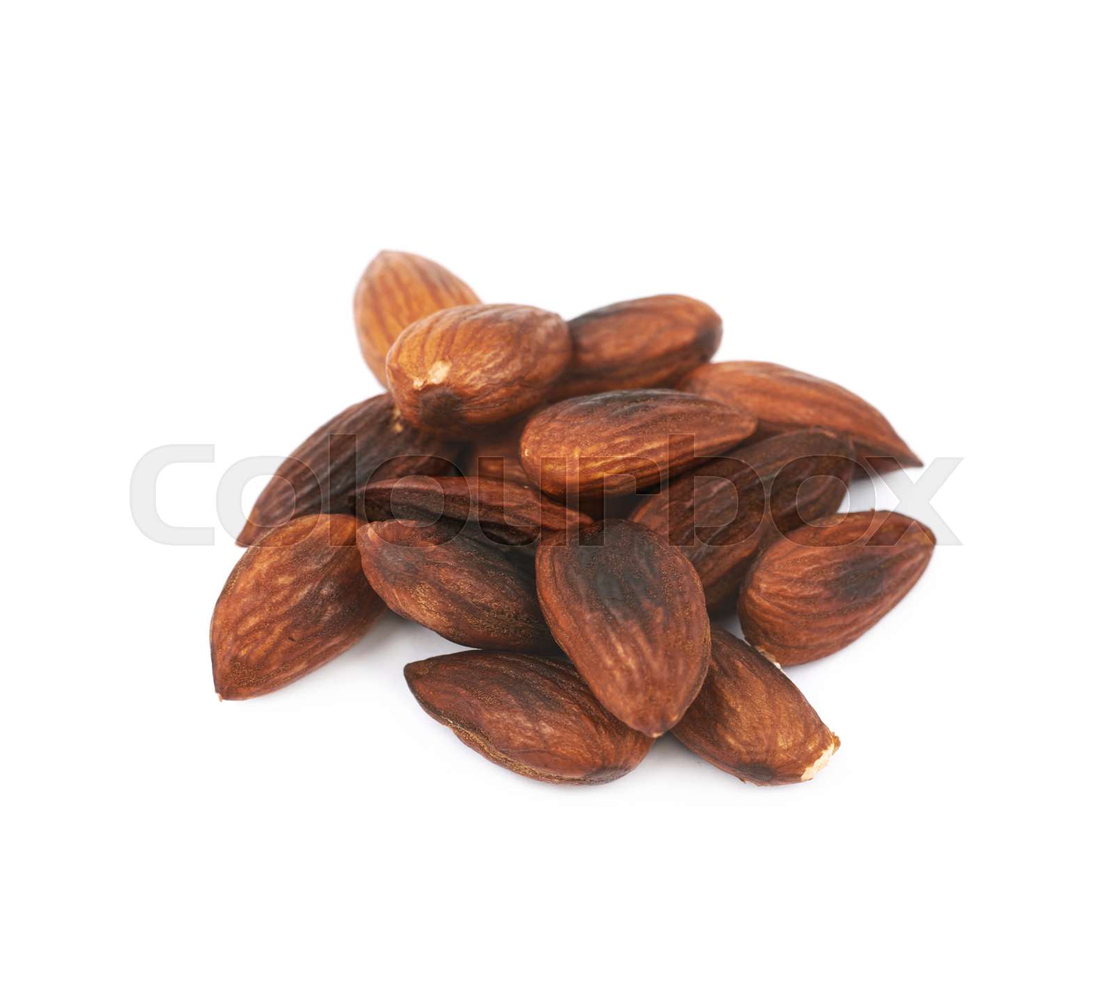Pile of fried almond nuts isolated | Stock image | Colourbox