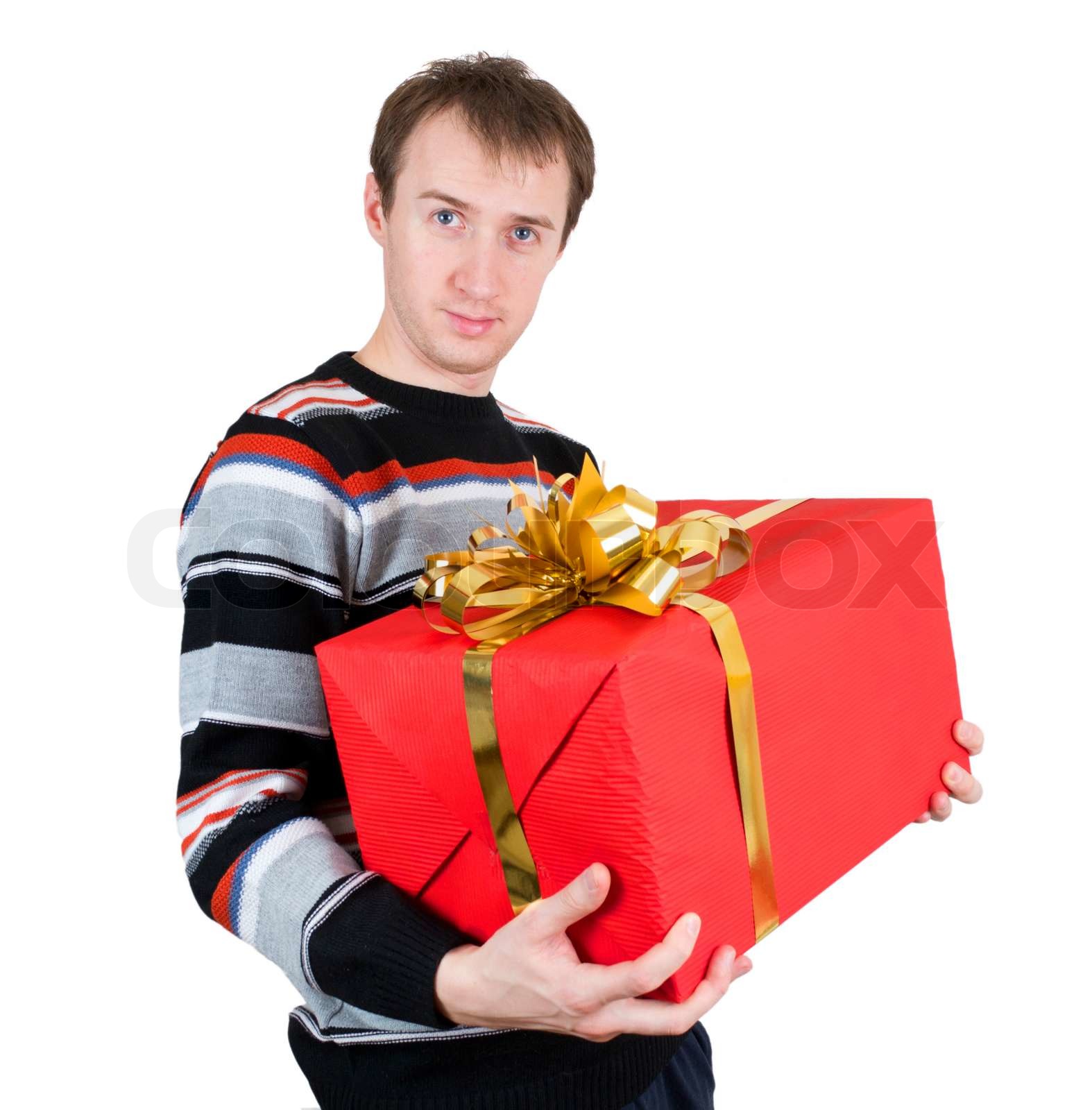 A man holding a big gift isolated on white background | Stock image ...