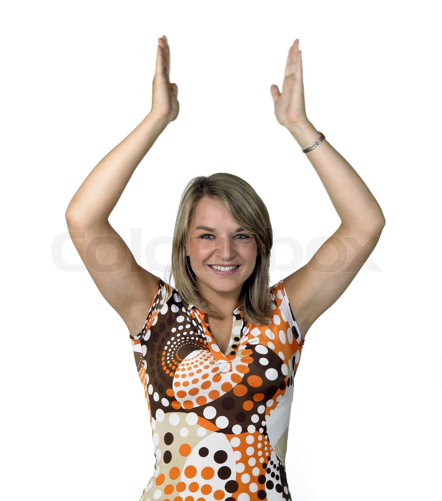 blond girl clapping her hands over head | Stock image | Colourbox