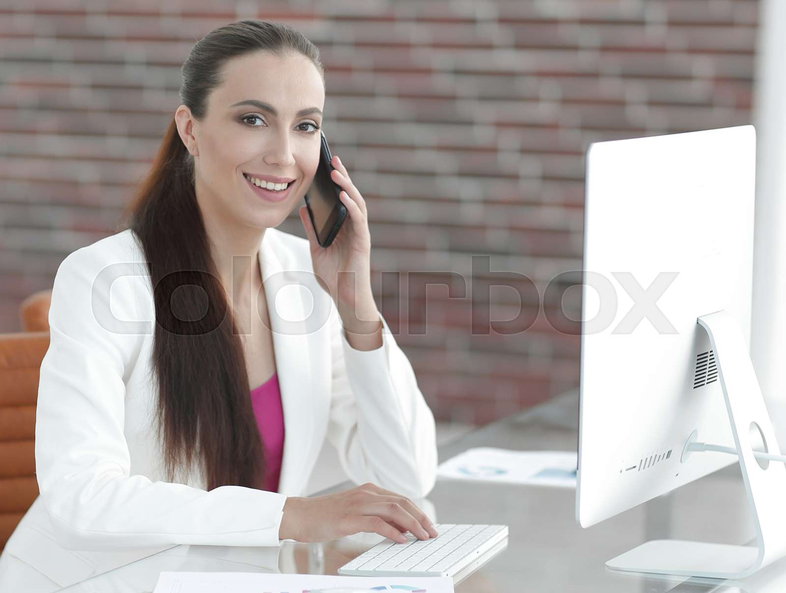 woman assistant at his workplace | Stock image | Colourbox