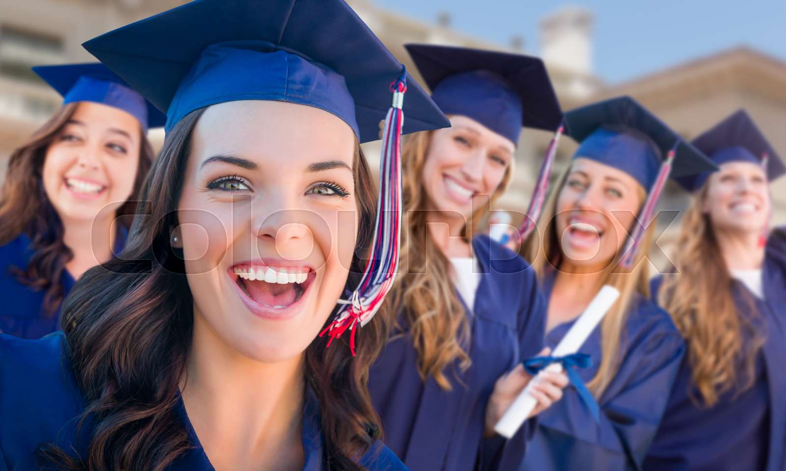 Happy Graduating Group of Girls In Cap and Gown Celebrating on Campus ...