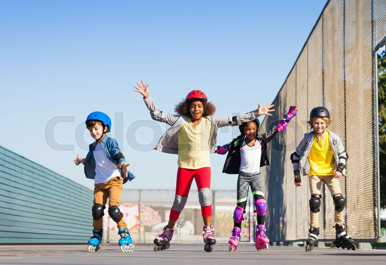 Happy skaters having fun at stadium | Stock image | Colourbox