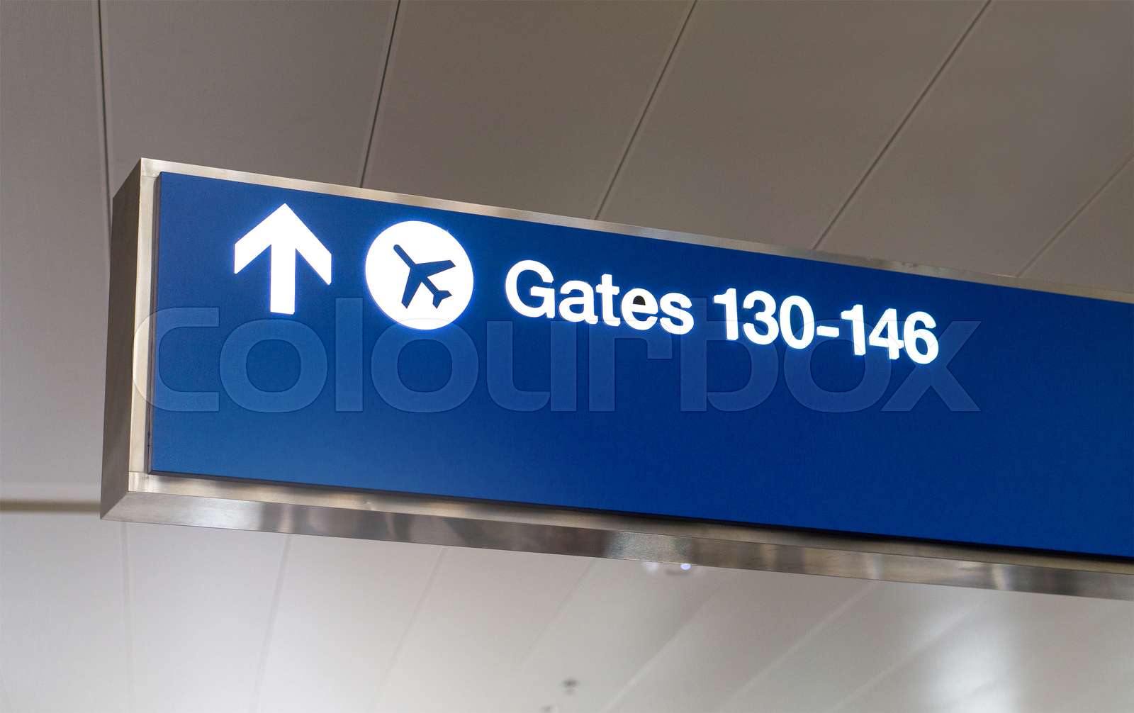 Airport sign showing direction to gate. | Stock image | Colourbox