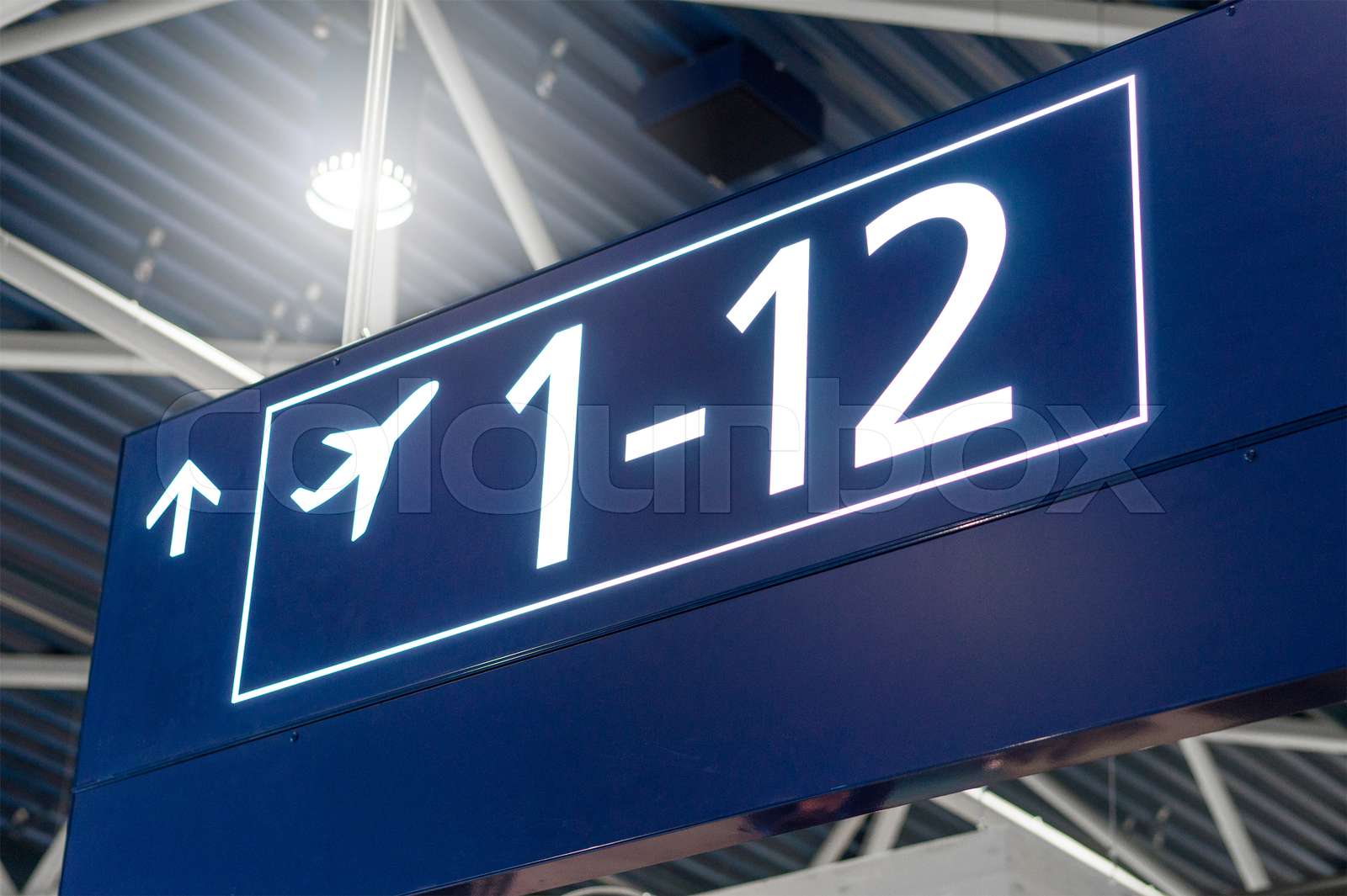 Airport sign showing direction to gate. | Stock image | Colourbox